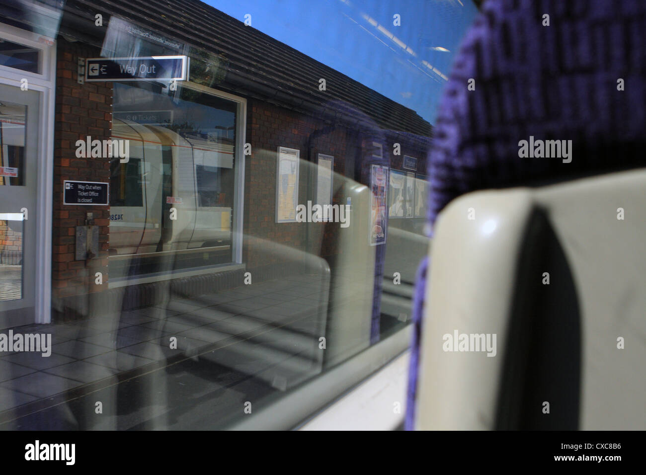 a view through a train window as it passes a train station Stock Photo ...