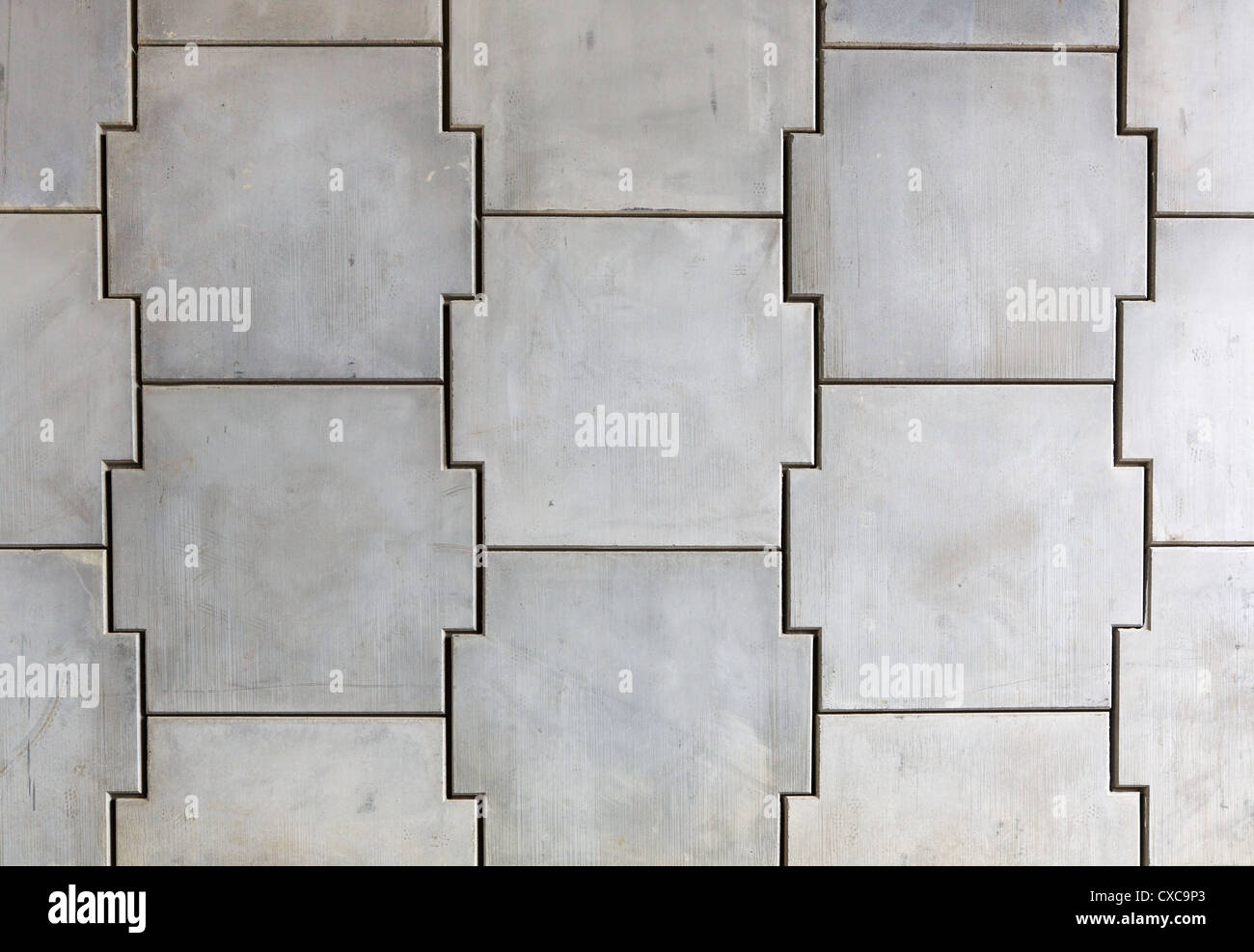 Interlocking concrete wall sections under a freeway Stock Photo - Alamy