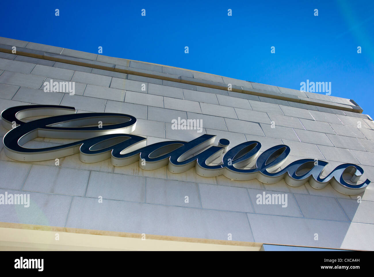 A sign above a Cadillac dealership Stock Photo - Alamy