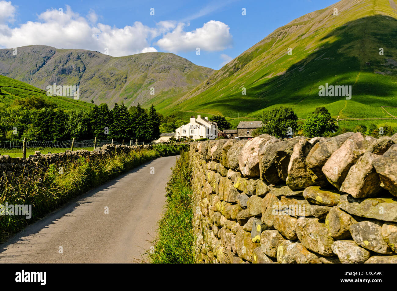 A narrow lane bordered by drystone walls leads to the Wasdale Head Inn ...
