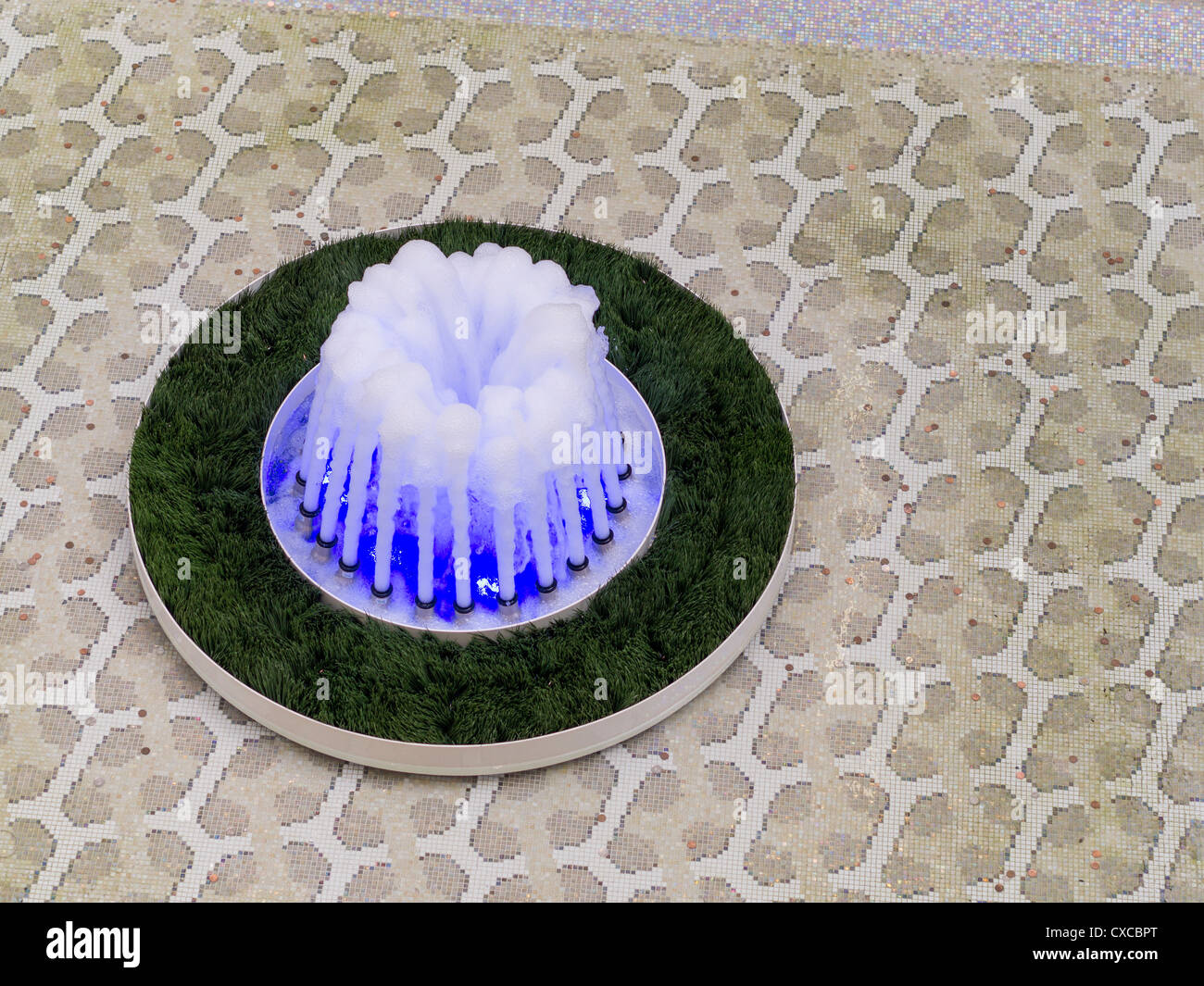 Fountain at the Mall. A fountain in a large pool of water. Pennies are ...
