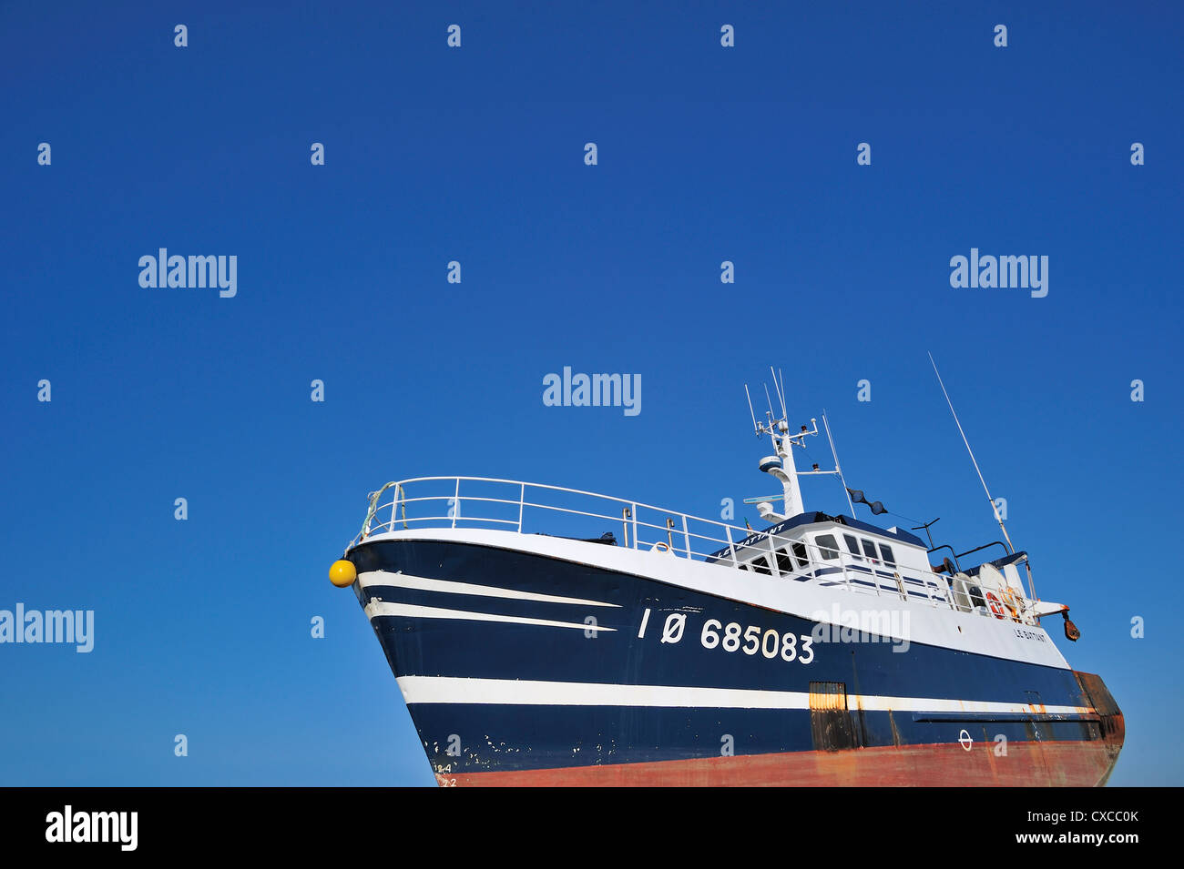 Bottom trawler fishing boat against blue sky in the Charente-Maritime ...