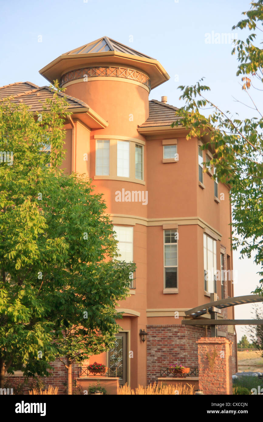 A modern stucco condominium building with turret Stock Photo - Alamy