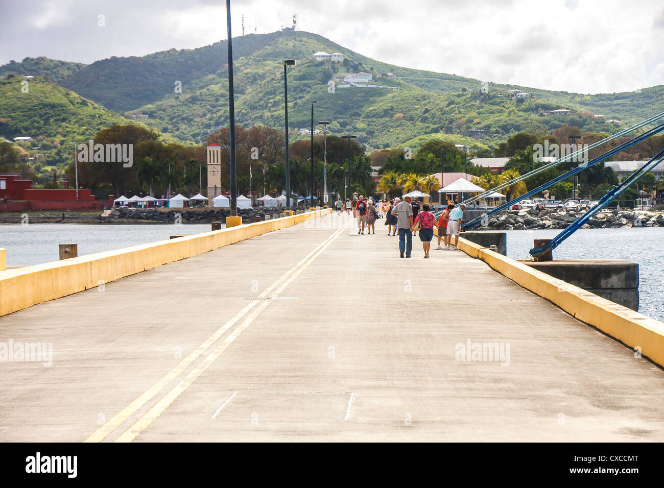 Tourists walking down pier toward port on St. Croix Stock Photo - Alamy