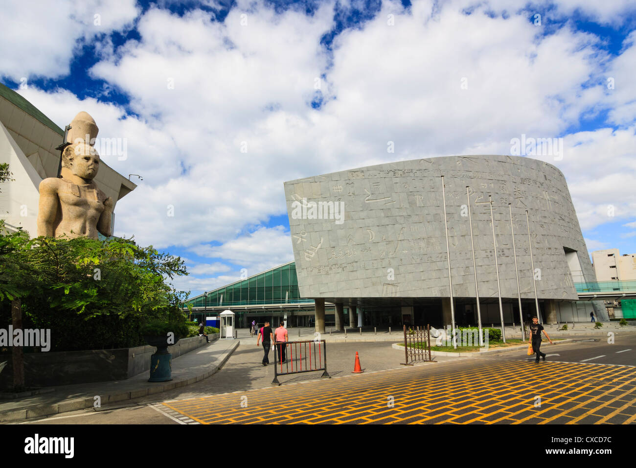 Colossal pharaonic statue and facade of the Bibliotheca Alexandrina or ...