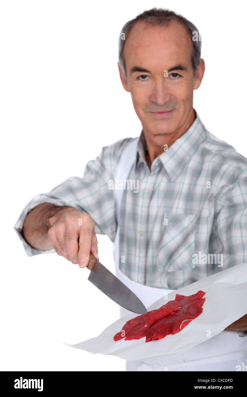 Butcher with fresh red meat Stock Photo - Alamy