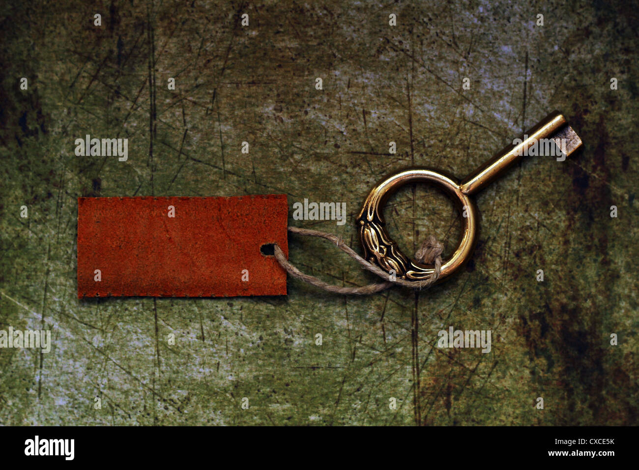 Old key and tag Stock Photo - Alamy