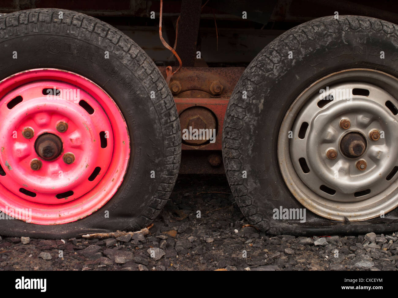 Two flat tyres Stock Photo - Alamy