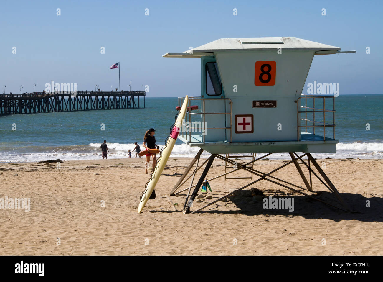 lifeguard station with pier in the background Stock Photo - Alamy
