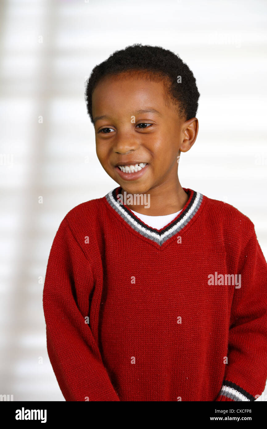 Portrait of a boy who is inside his home Stock Photo - Alamy