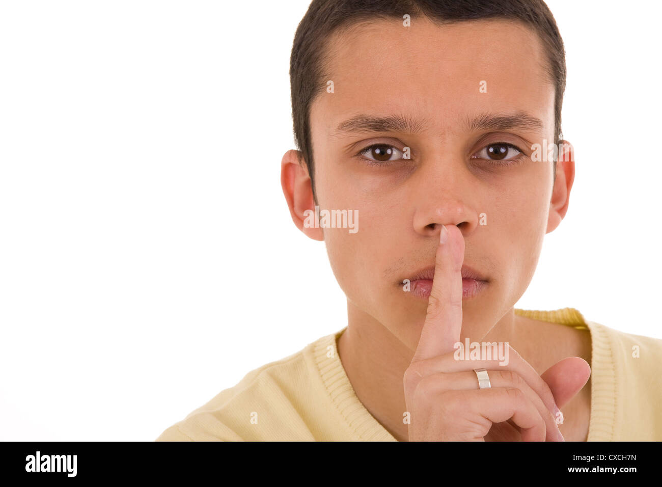 Man showing the sign for silence with his index finger Stock Photo - Alamy