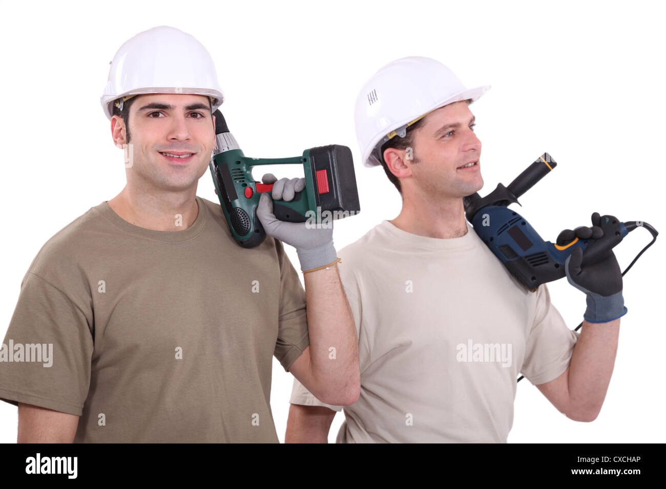 Two male builder with drills Stock Photo - Alamy