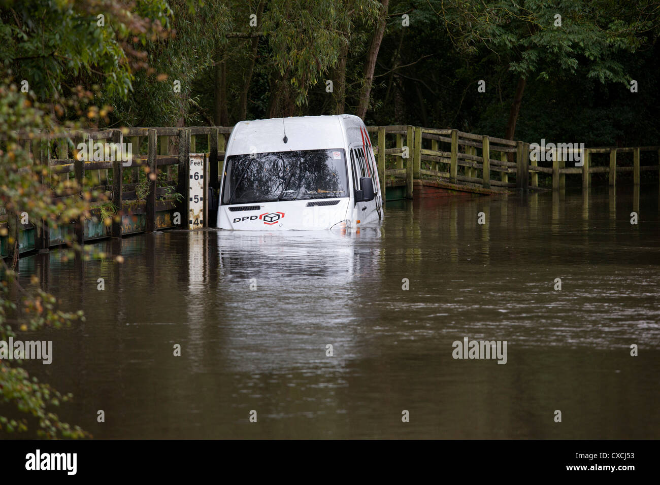 A parcel delivery van is trapped in a ford after heavy rain in Henwood ...