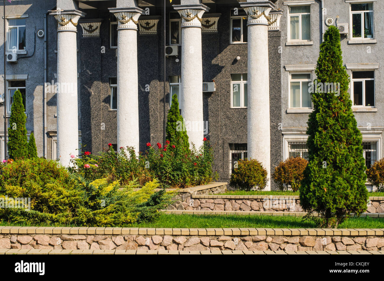 Image of old fashioned building with columns and pine tree Stock Photo ...