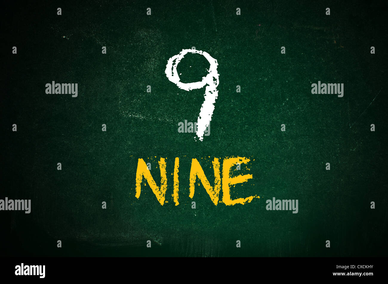 Number nine, handwritten number nine with a chalk on a green chalkboard ...