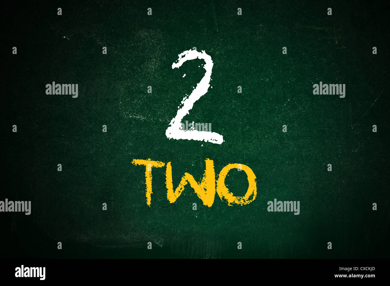 Number two, handwritten number two with a chalk on a green chalkboard ...