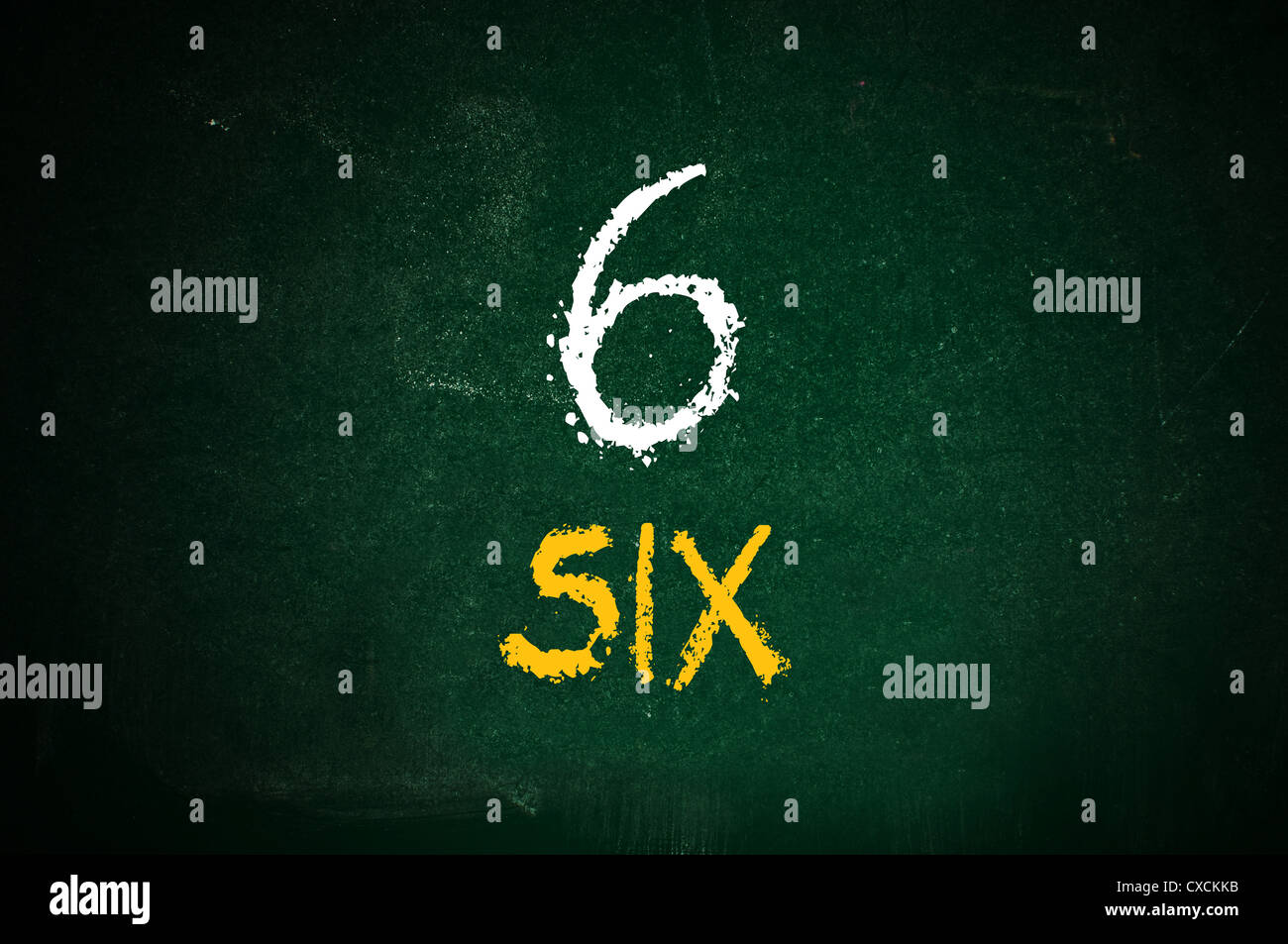 Number six, handwritten number six with a chalk on a green chalkboard ...