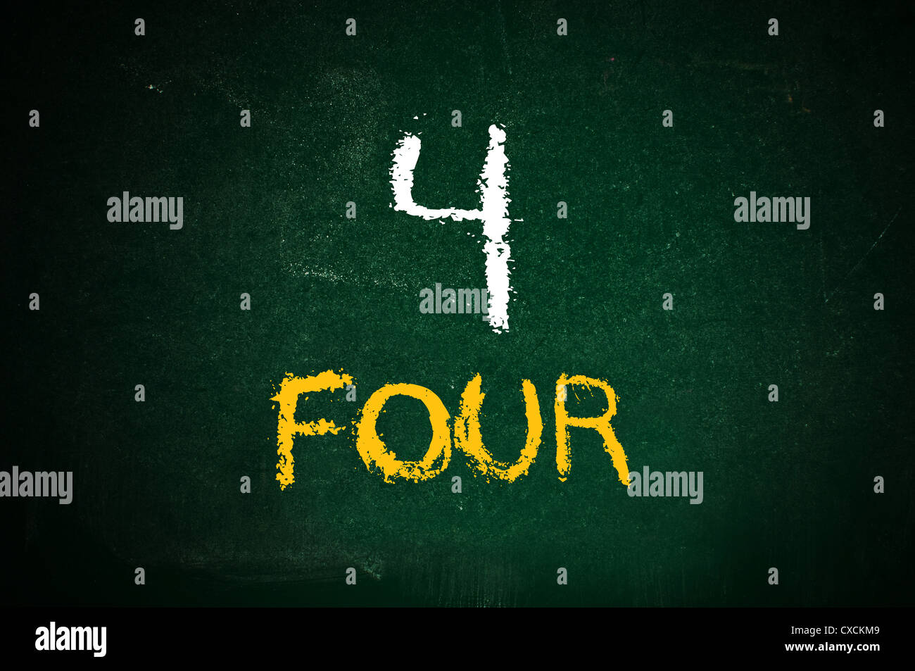 Number four, handwritten number four with a chalk on a green chalkboard ...