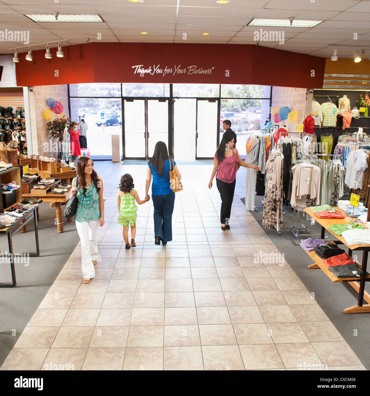 People shopping in clothing store Stock Photo - Alamy