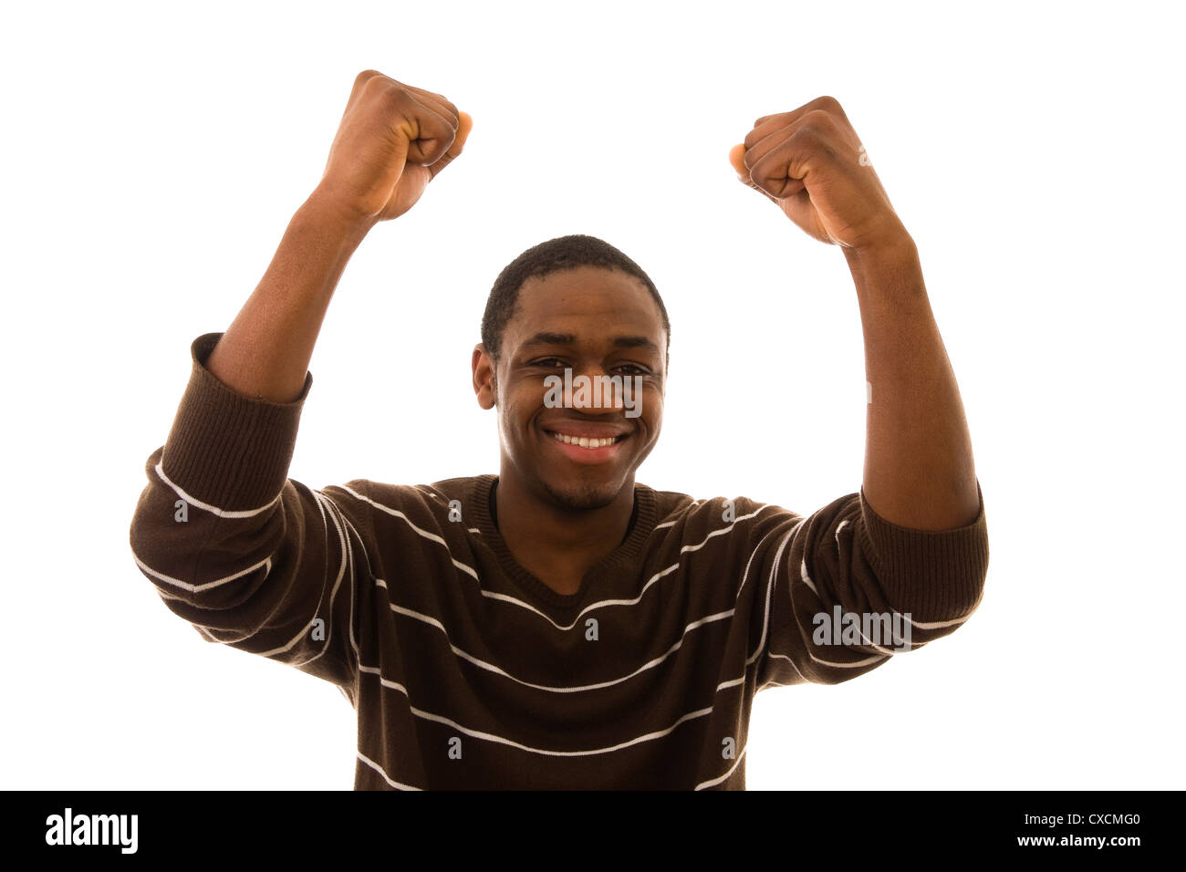 Young happy man with arms up celebrating something Stock Photo - Alamy