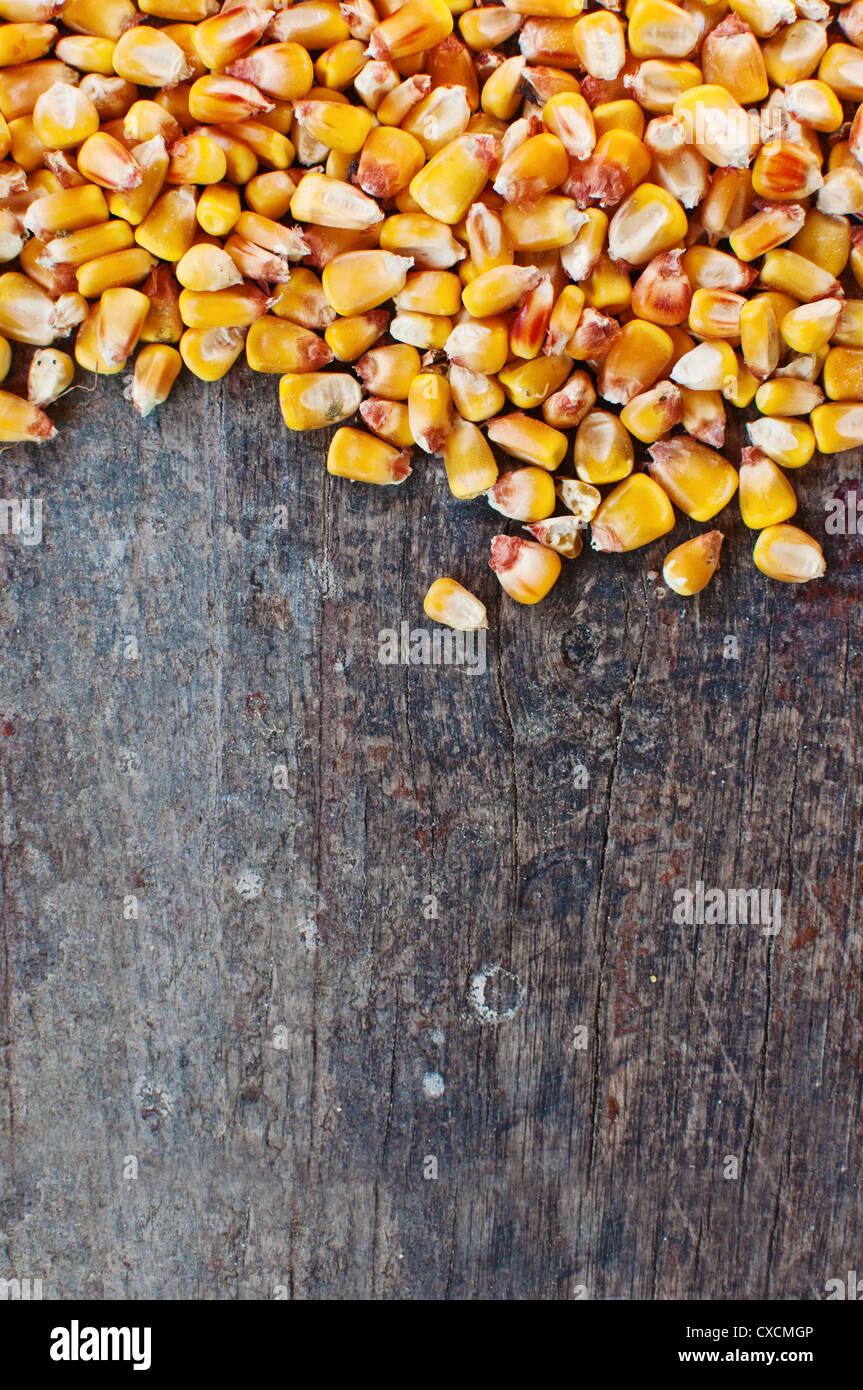 Beautiful yellow corn kernels on a wooden table Stock Photo - Alamy