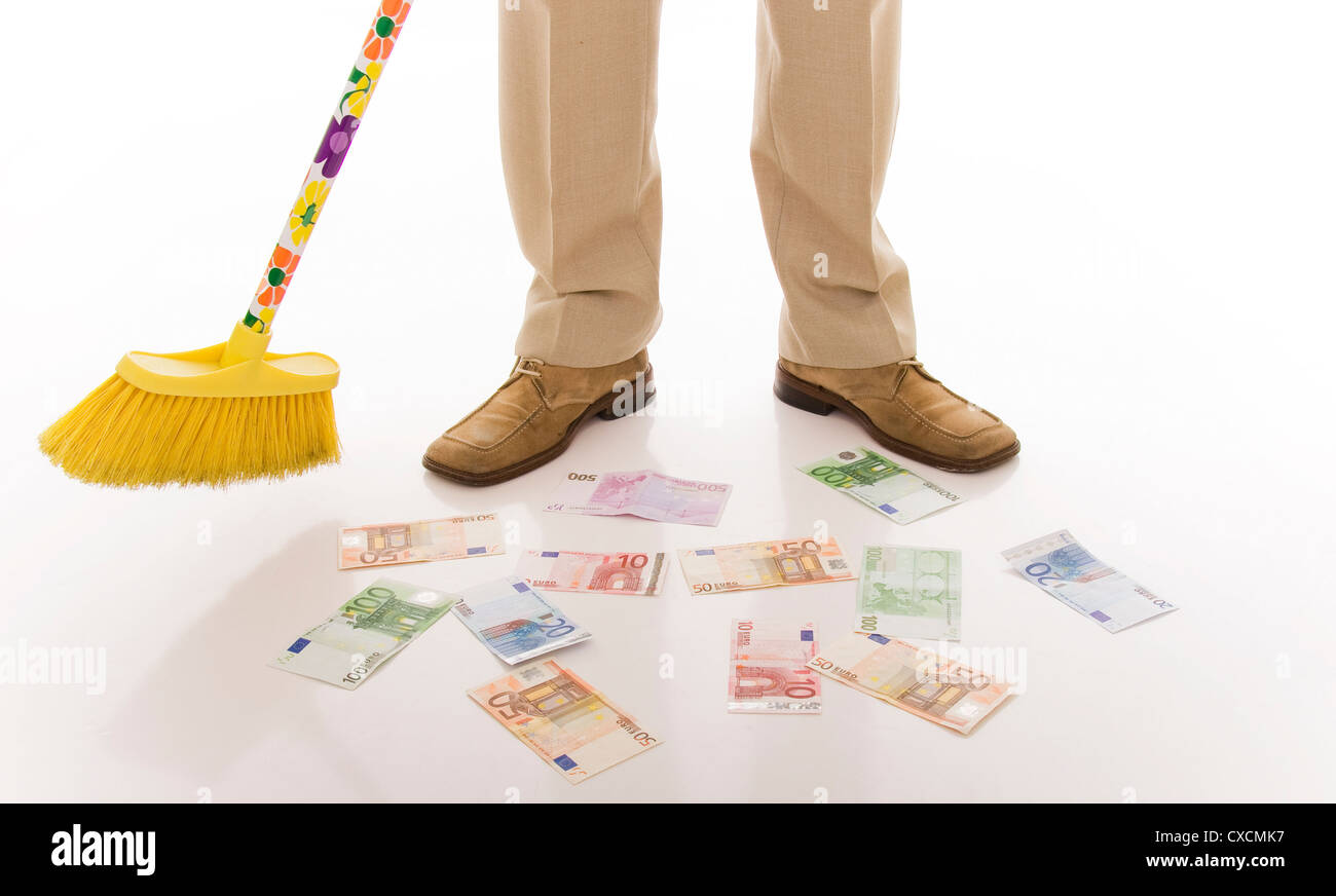 business man sweeping euro banknotes on the floor Stock Photo - Alamy