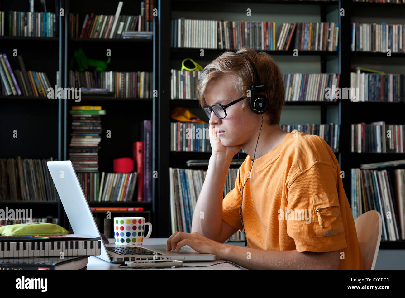 TEENAGE BOY BEDROOM COMPUTER Studious relaxed teenage school boy ...