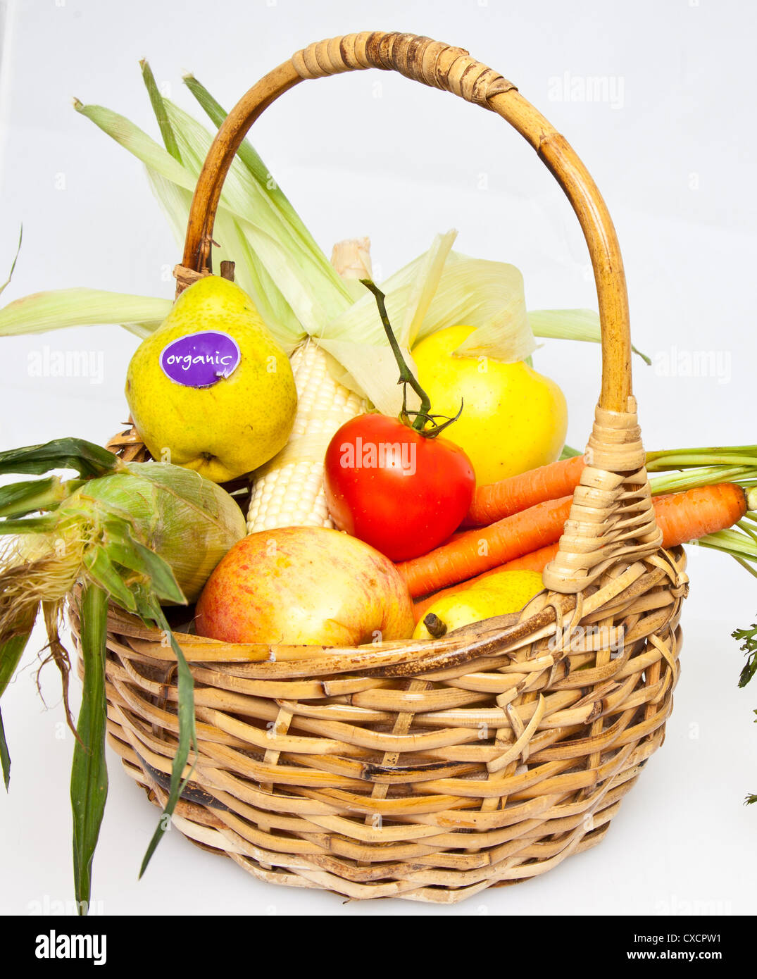 A basket of fresh vegetables in a wicker basket Stock Photo - Alamy