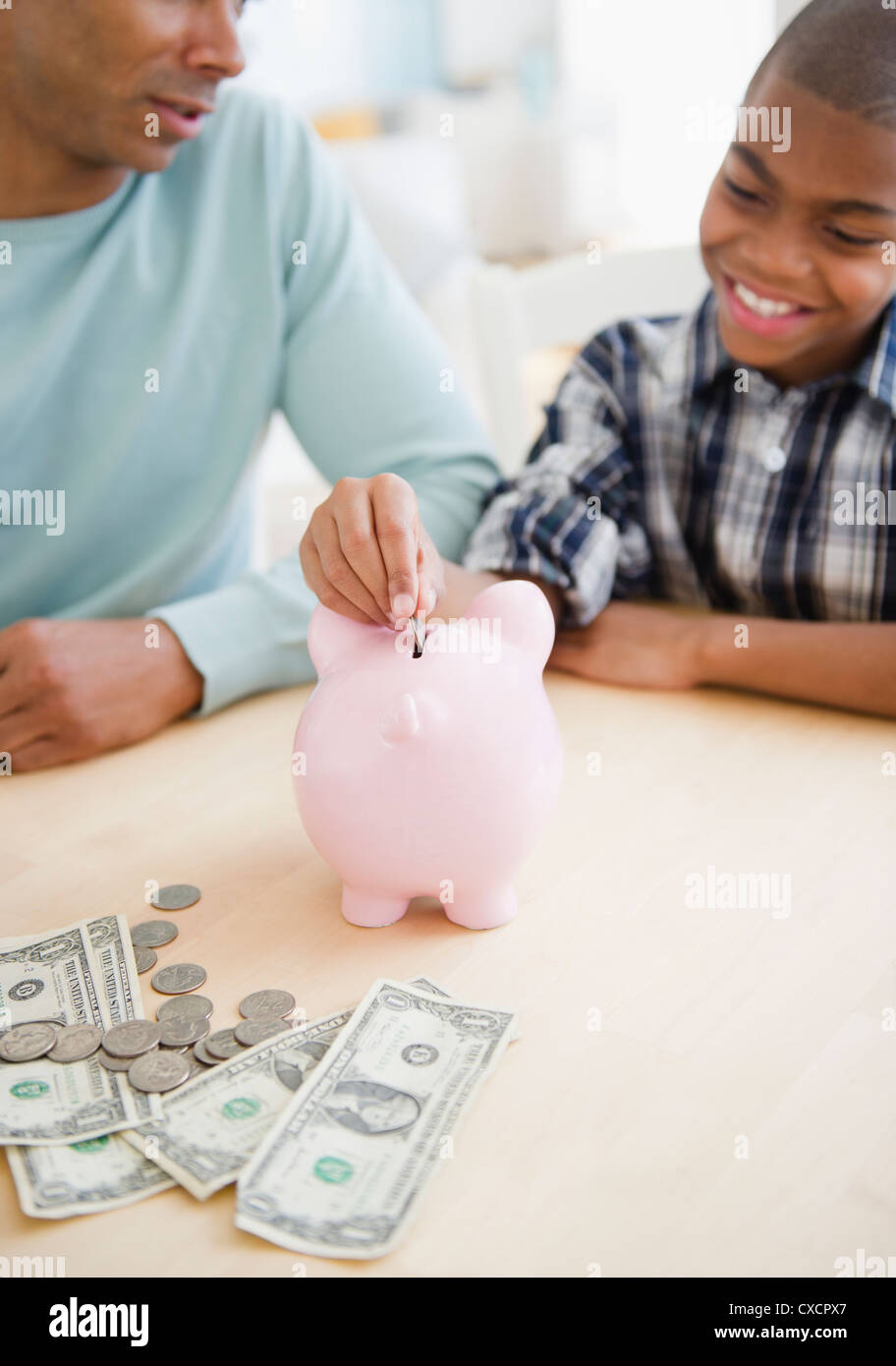 Father and son counting money hi-res stock photography and images - Alamy