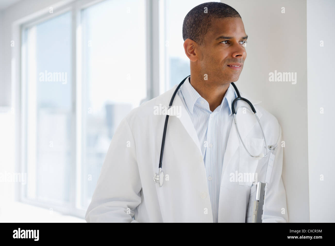 Black man lab coat thinking hi-res stock photography and images - Alamy