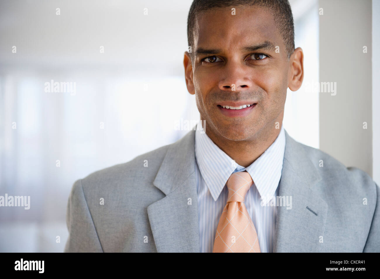 Serious mixed race businessman Stock Photo - Alamy