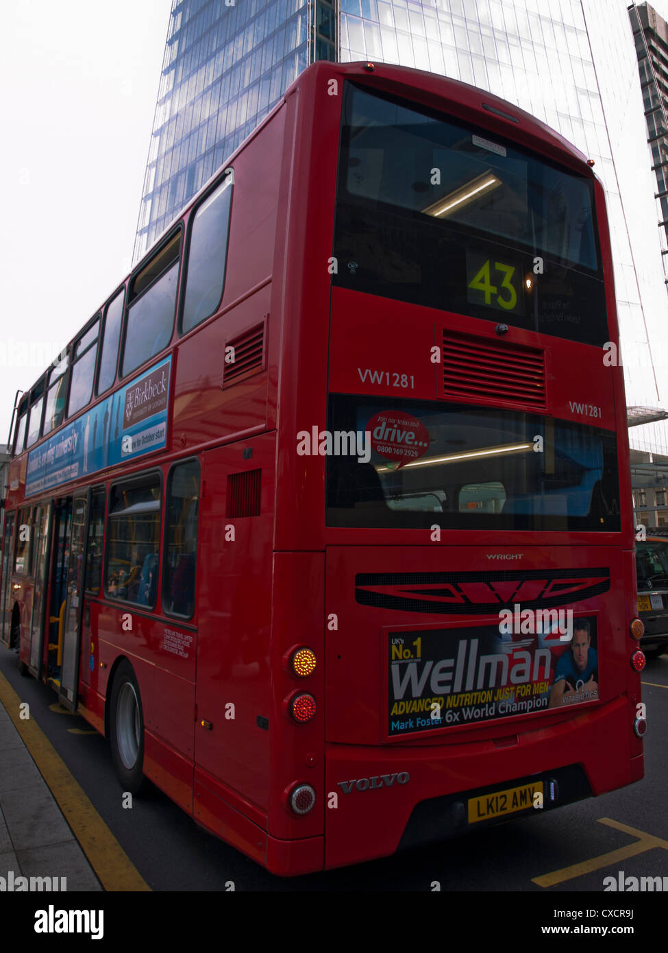 Rear of a red London bus at London Bridge Bus Station showing the Shard ...