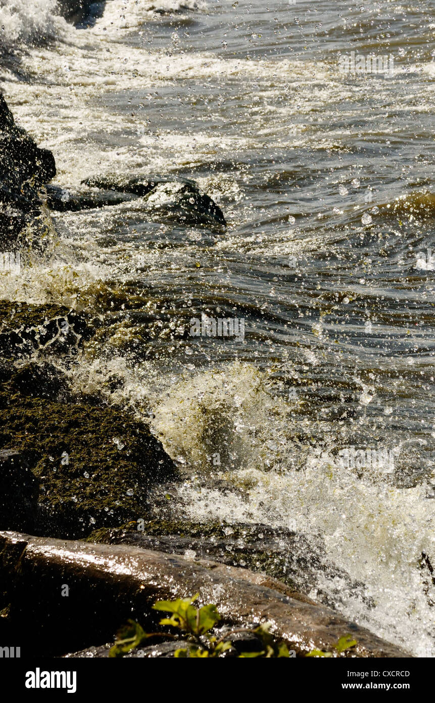 Lake Ontario waves pound breakwater rocks on US coast Stock Photo - Alamy