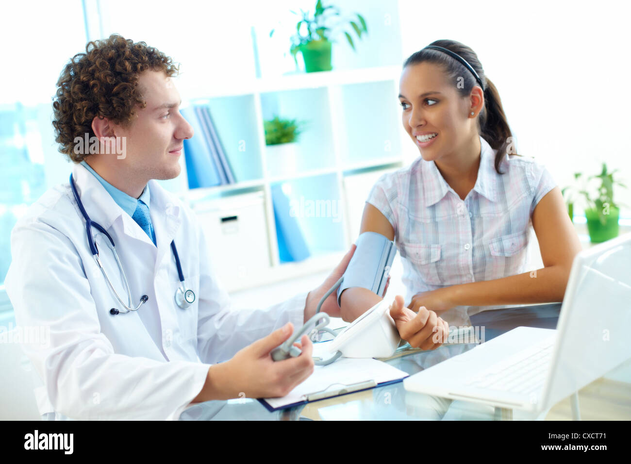 Image of doctor measuring pressure of patient on tonometer Stock Photo ...