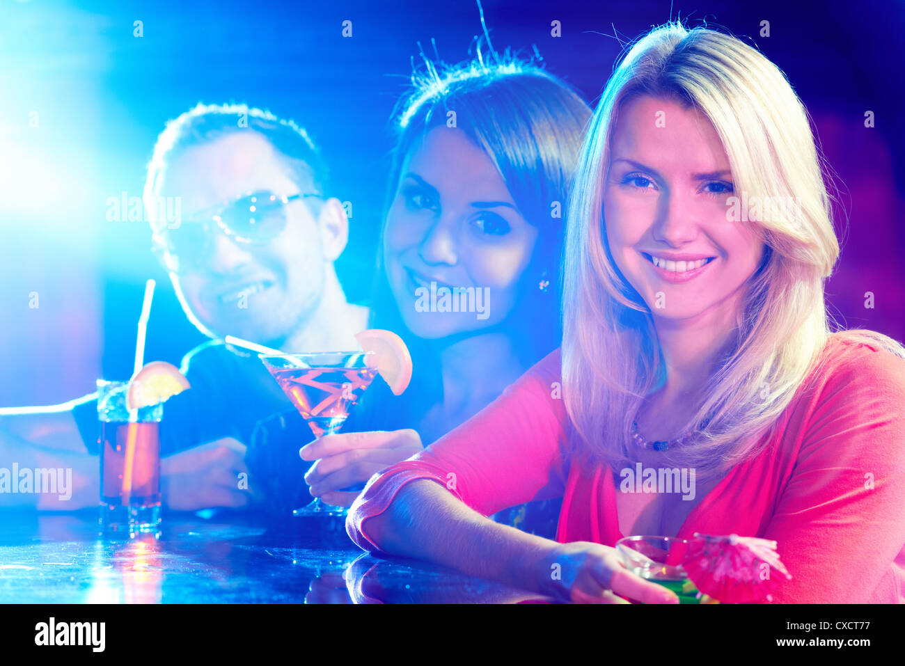 Portrait of happy friends having party in bar Stock Photo - Alamy
