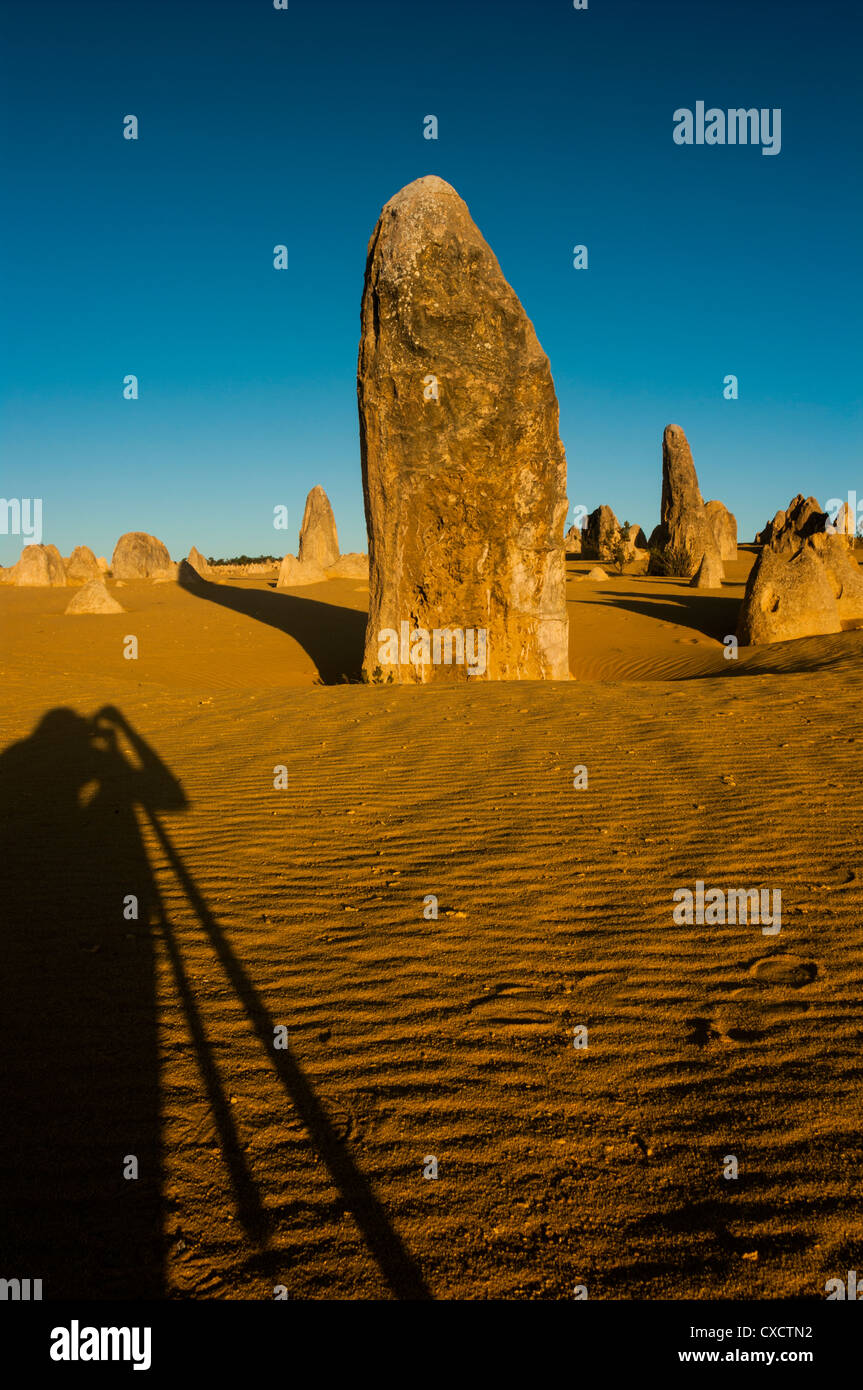 The shadow of a photographer taking a photo of the ancient limestone ...