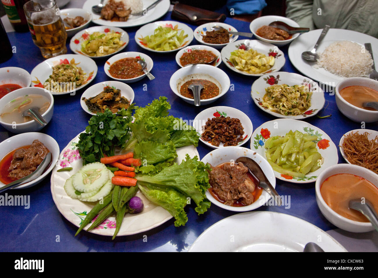 Myanmar, Burma, Kalaw. Curry lunch of pork, cucumbers, beans, soup ...