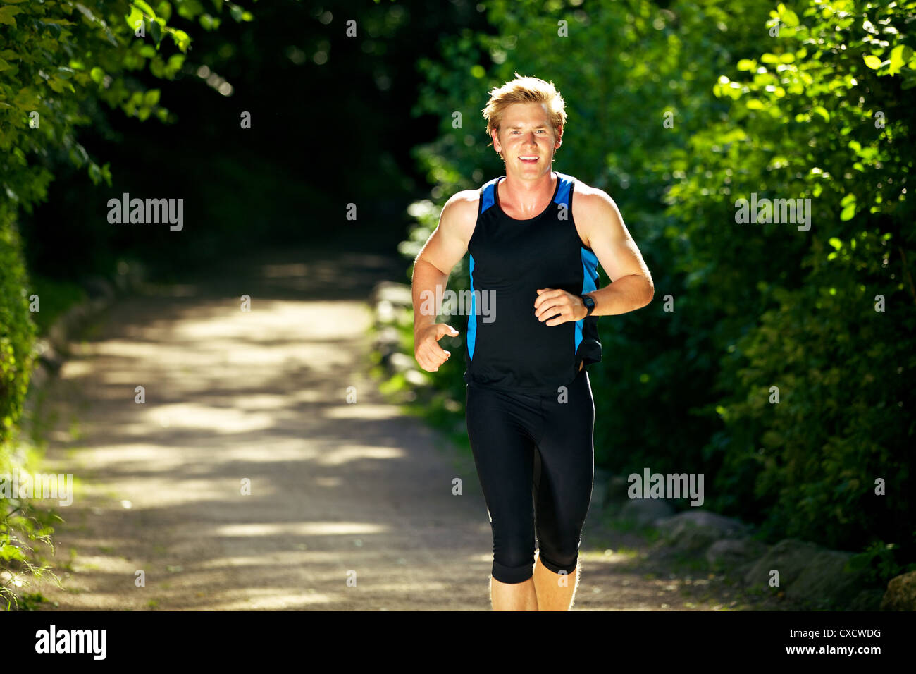 Sweating man jogging outdoors Stock Photo - Alamy