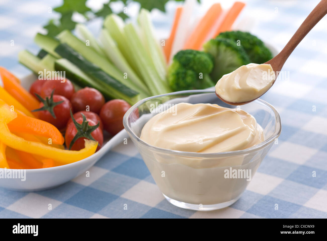 Scooping Mayonnaise with Spoon Stock Photo - Alamy