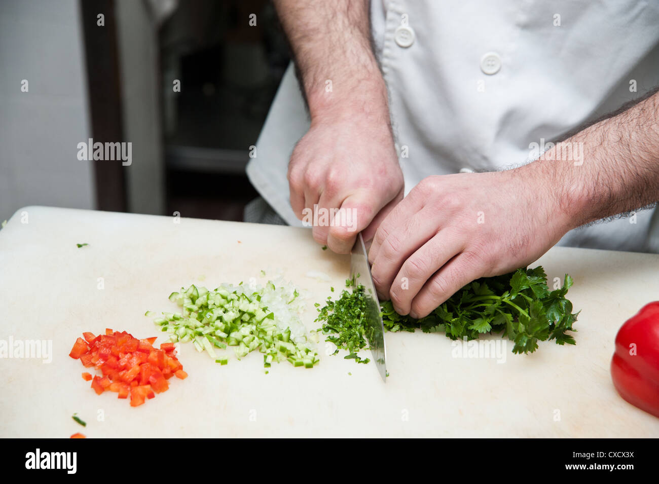 Chef cuts vegetables for a salad close up of the hands and knife Stock ...