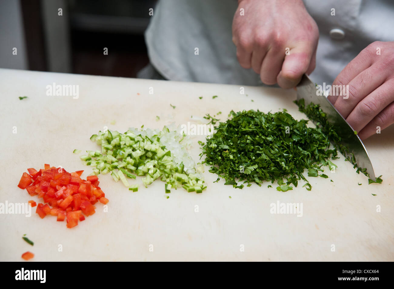 Chef cuts vegetables for a salad close up of the hands and knife Stock ...
