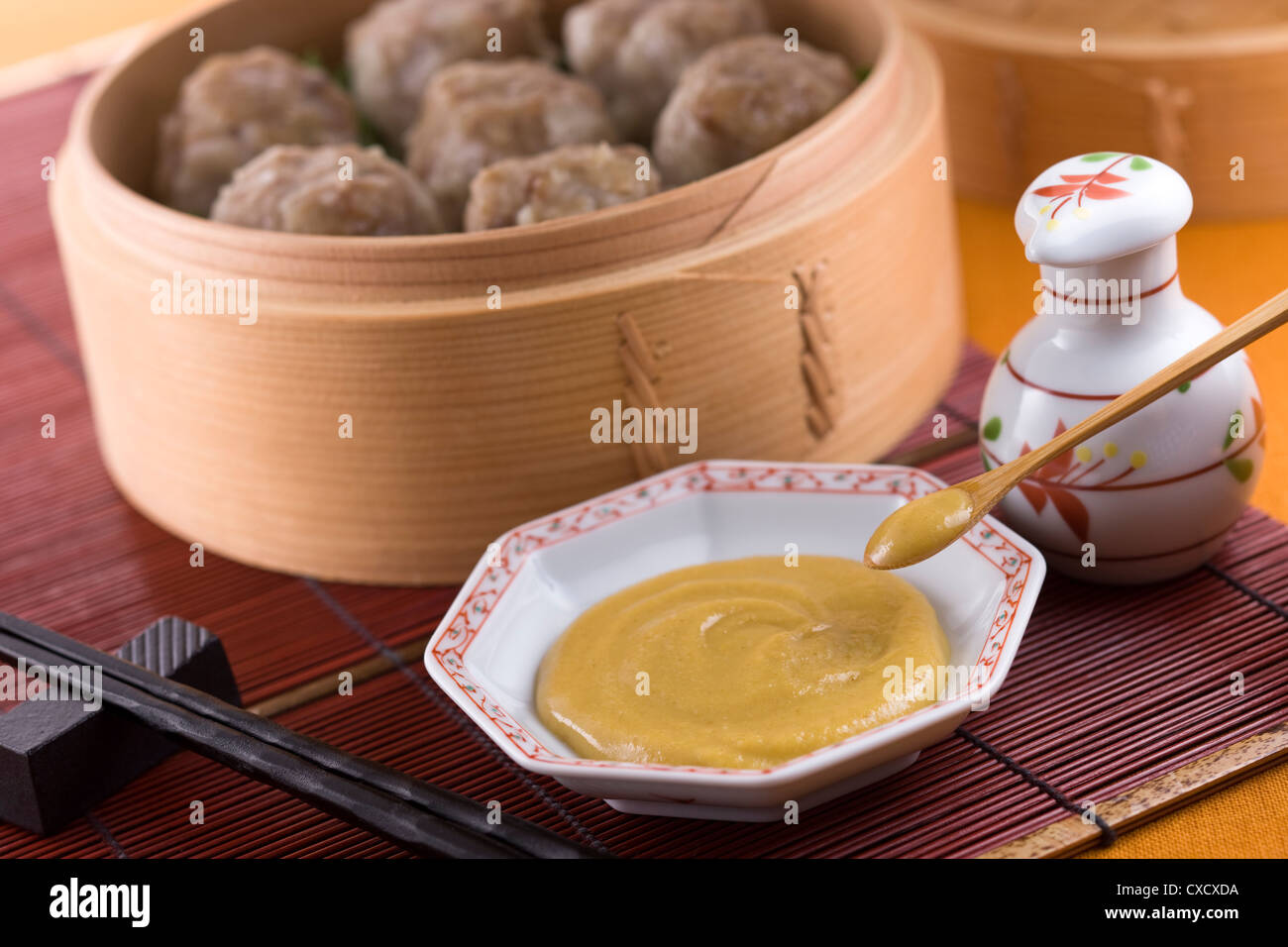Scooping Chinese Hot Mustard with Small Spoon Stock Photo - Alamy