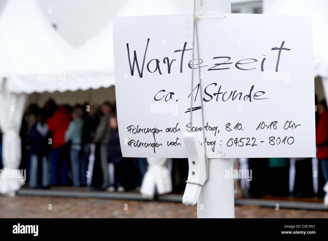 Sign with waiting time Stock Photo - Alamy