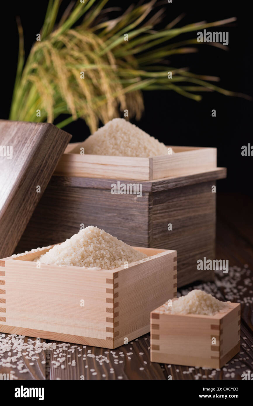 Rice in Box and Measuring Cup Stock Photo - Alamy