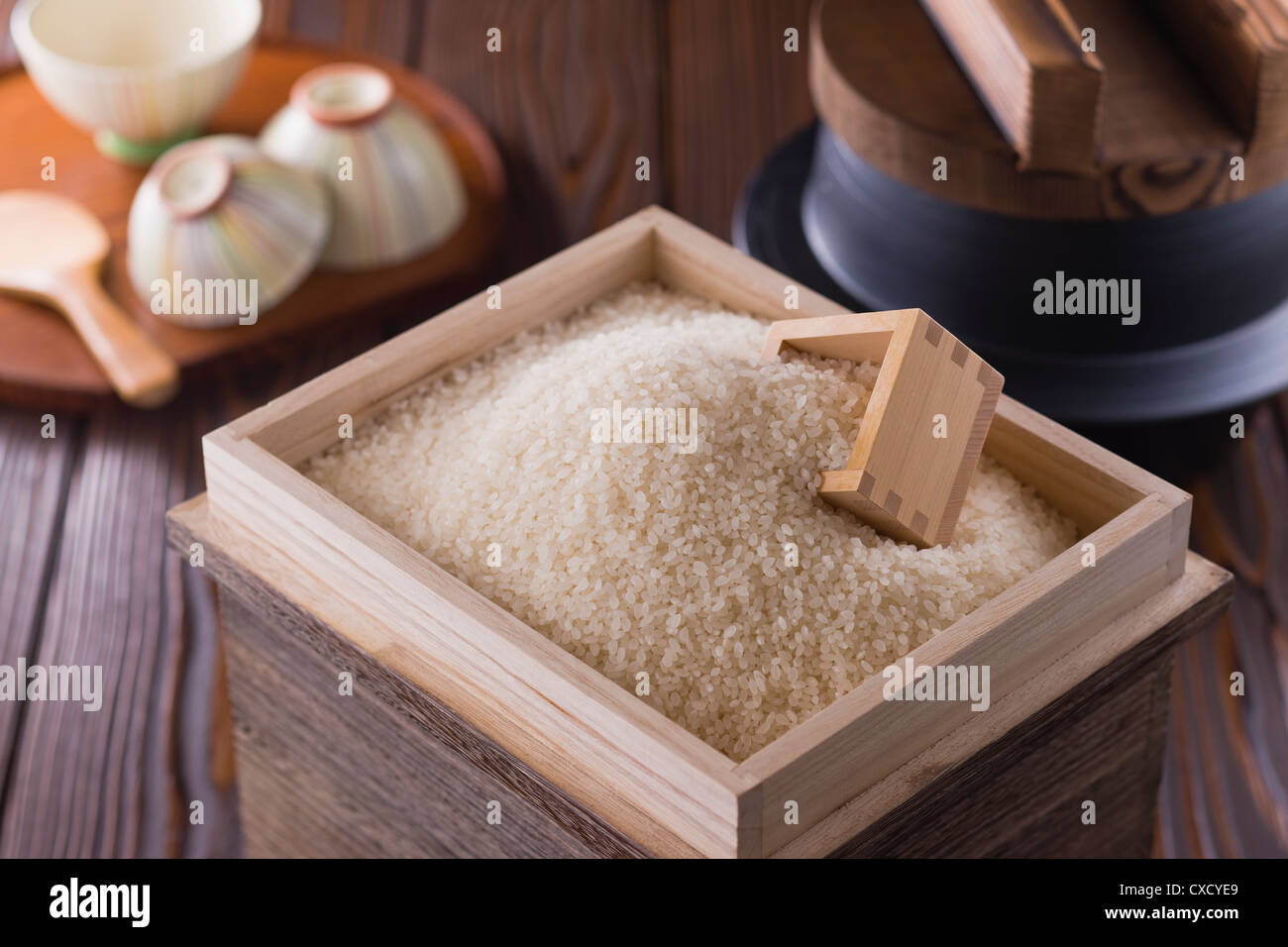 Rice and Measuring Cup in Box Stock Photo - Alamy