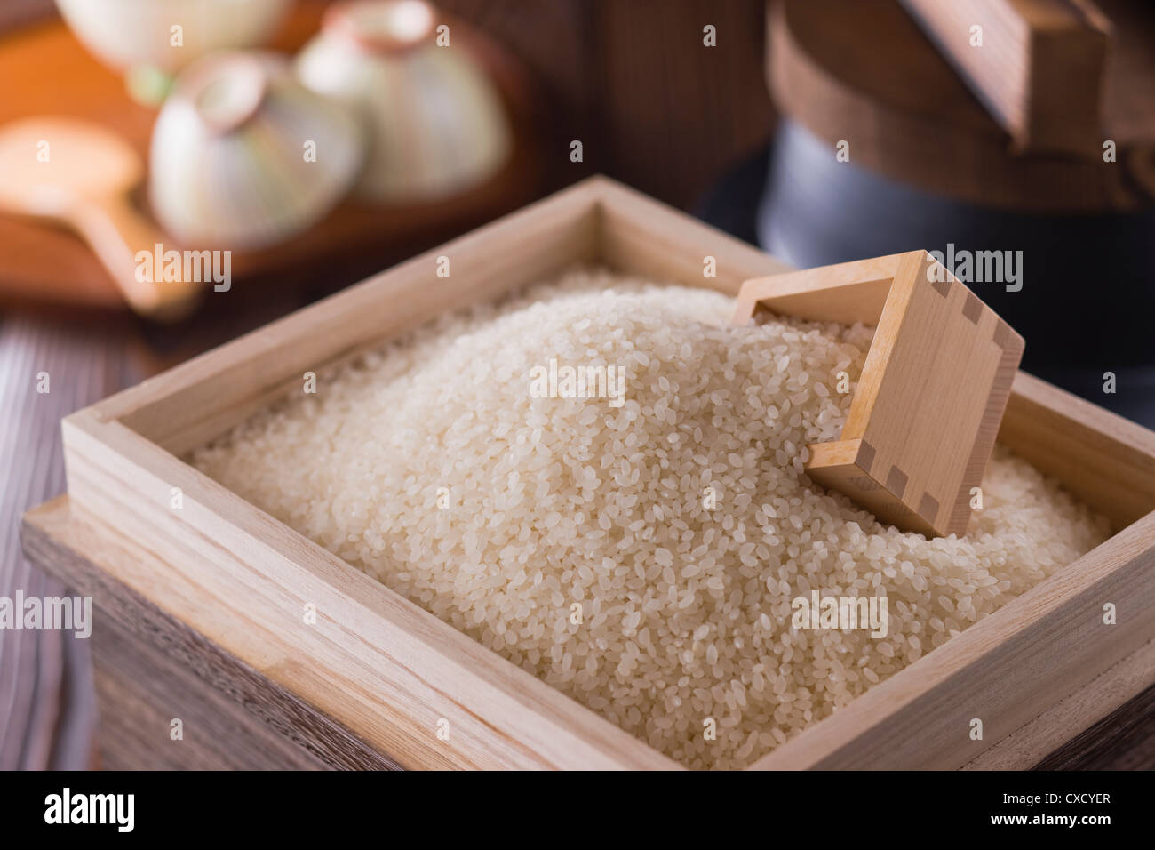 Rice and Measuring Cup in Box Stock Photo - Alamy