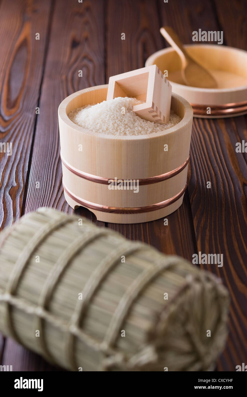Rice and Measuring Cup in Wooden Tub Stock Photo - Alamy
