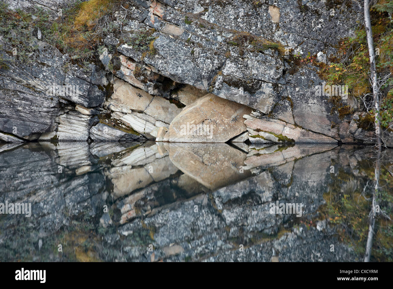 Arrowhead reflection in the rock-clif shore of Horseshoe Lake, Jasper ...
