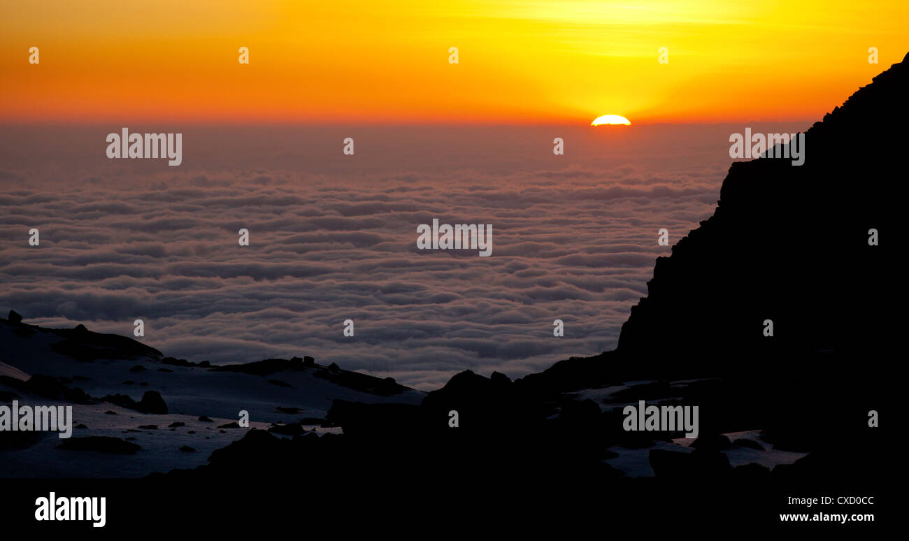 View over mountains with clouds in the distance at sunset, Gosaikunda ...