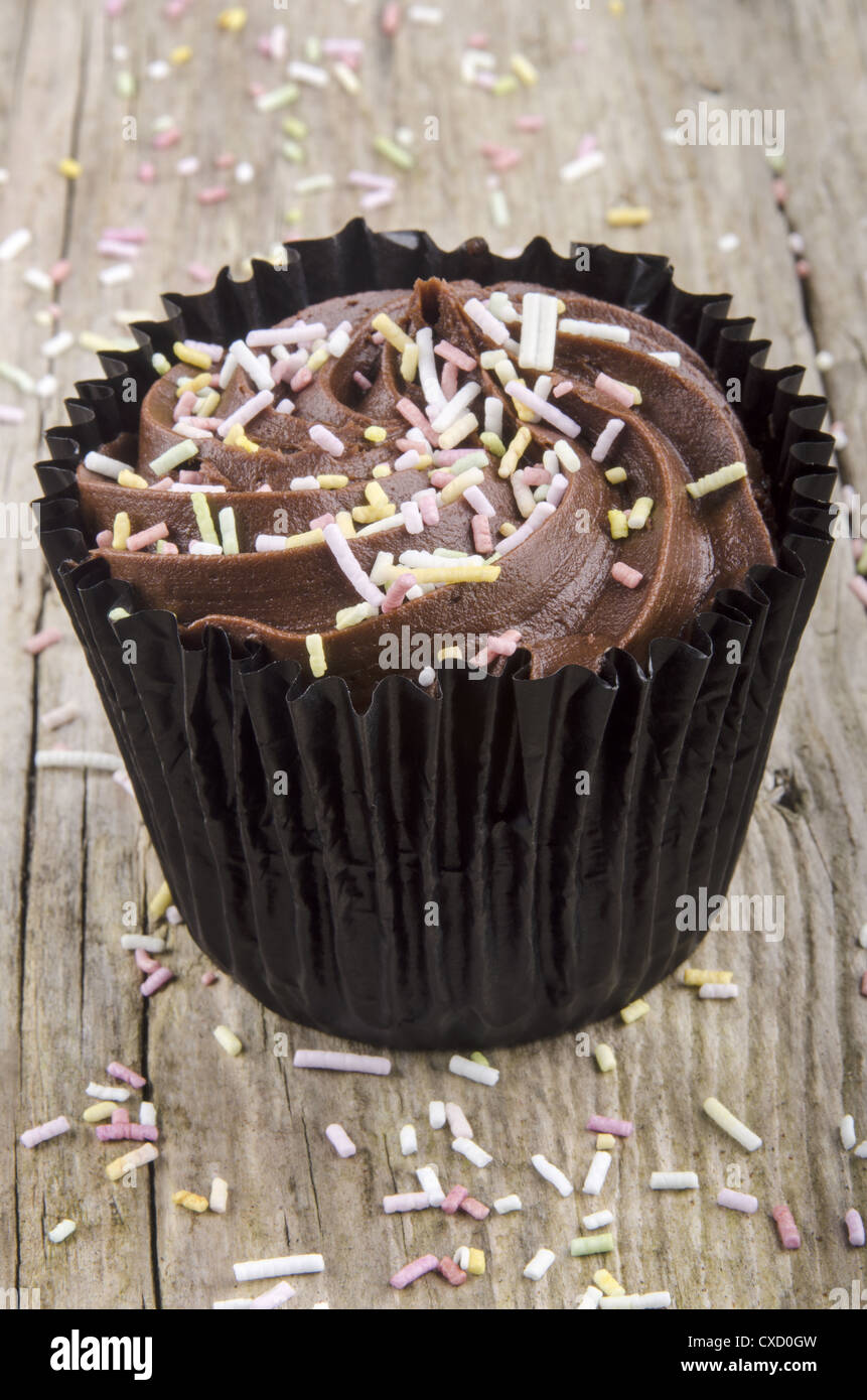 cup cake with chocolate buttercream and colored sprinkles Stock Photo ...